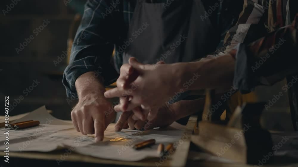 Wood, Men Concentrated Two fellow workers studying drawings of wooden ...