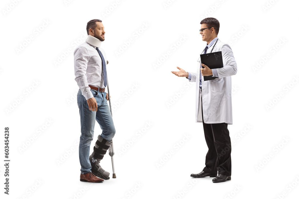 Doctor talking to an injured male man with an orthopedic boot and ...