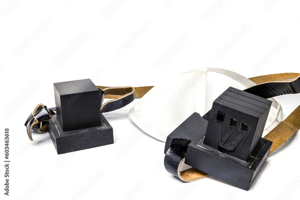 Tefillin or phylacteries . Pair of black leather boxes for the arm and ...