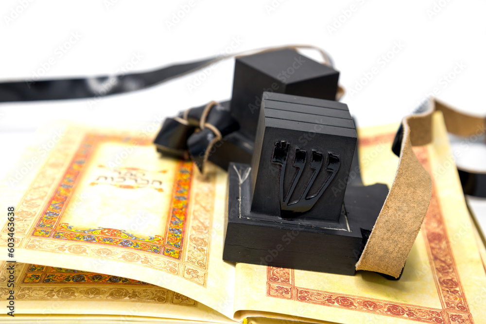 Tefillin or phylacteries . Pair of black leather boxes for the arm and ...