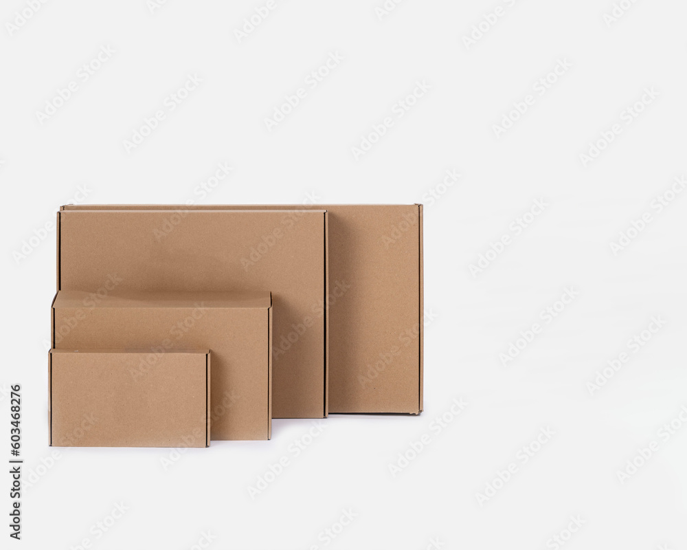 cardboard boxes different in size on a white background Stock Photo ...