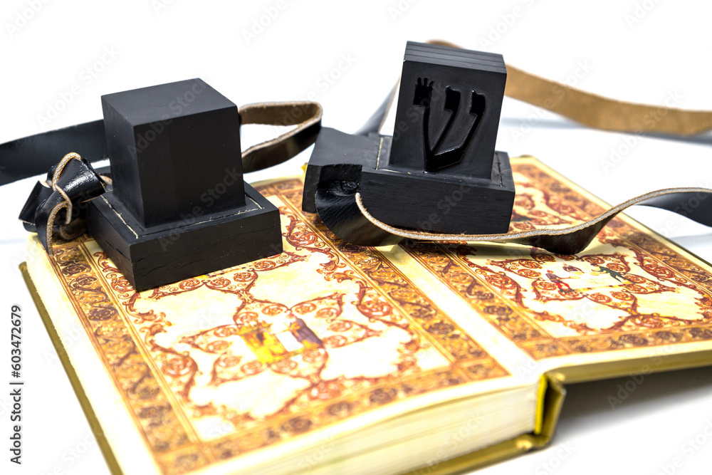 Tefillin or phylacteries . Pair of black leather boxes for the arm and ...