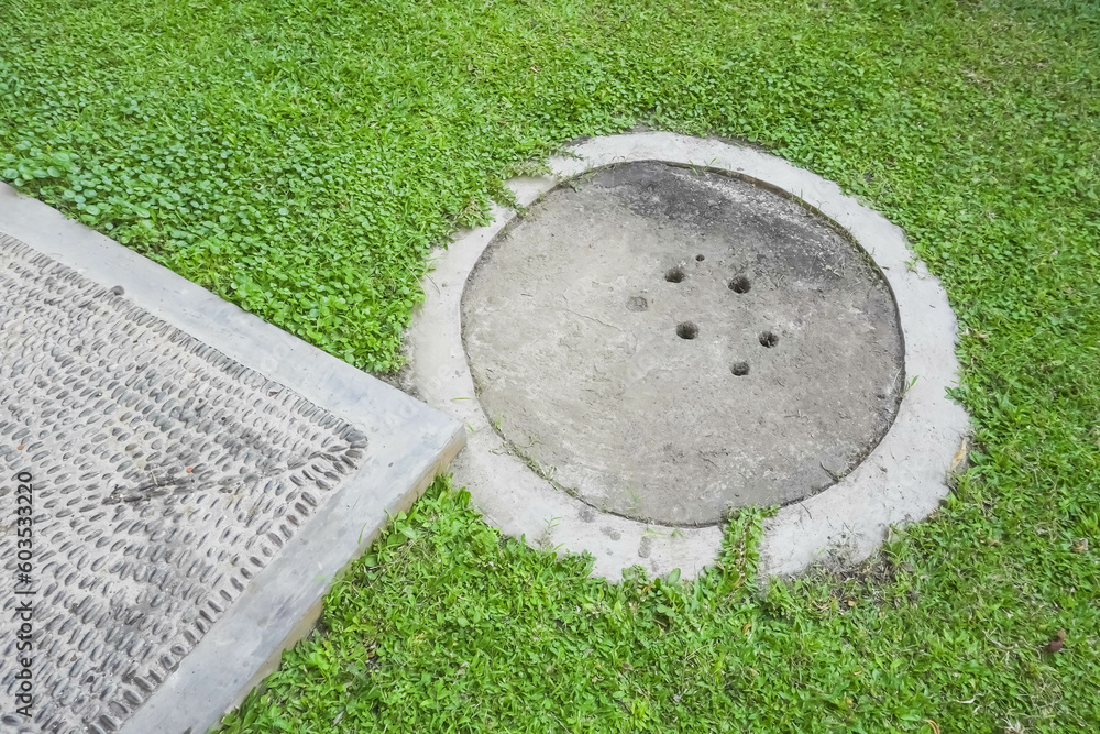 Cement water drainage holes installed in lawn areas to reduce the ...