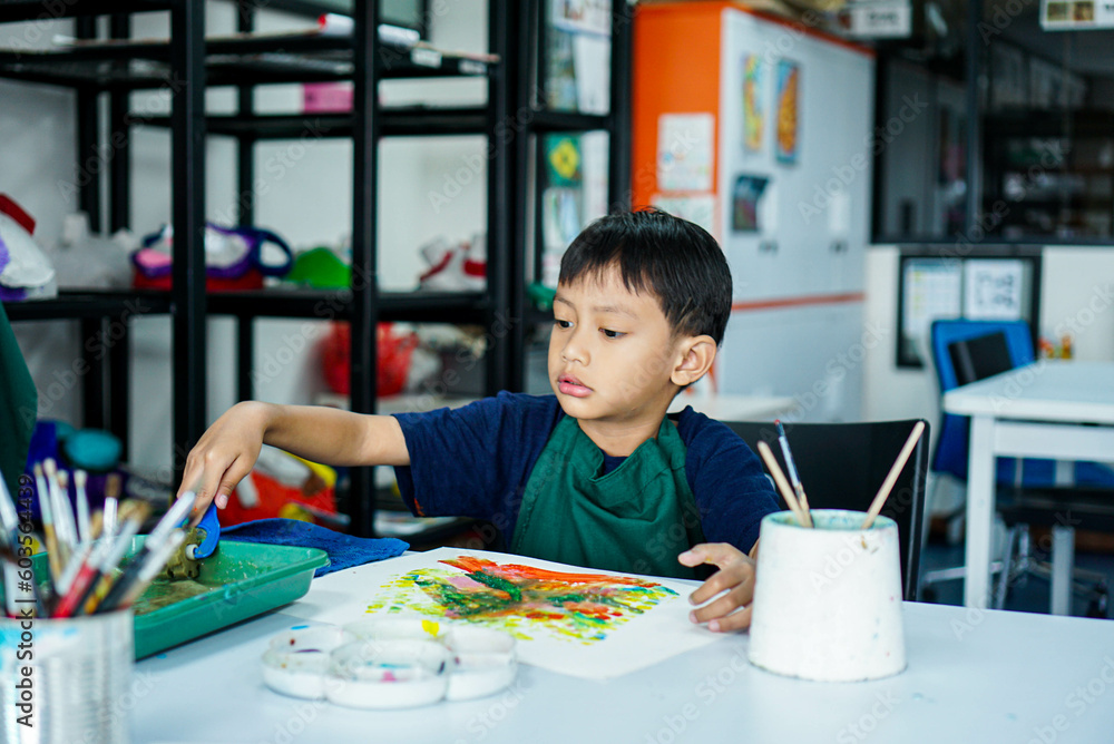 Cute little asian boy kids doing art painting activities in the ...