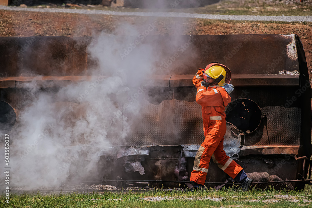 Firefighters forge through the outdoor location their steps resolute ...