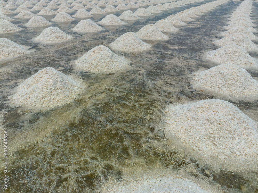 Sea salt farm. Pile of brine salt. Raw material of salt industrial ...