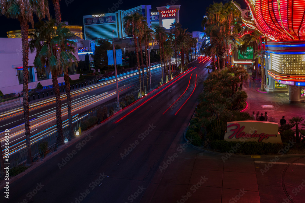 Beautiful out-of-focus strip road tracers. Night view of Las Vegas cityscape with gorgeous ...