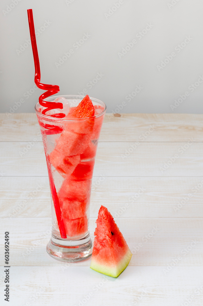 A glass of cold watermelon water, watermelon juice with ice, a soft ...