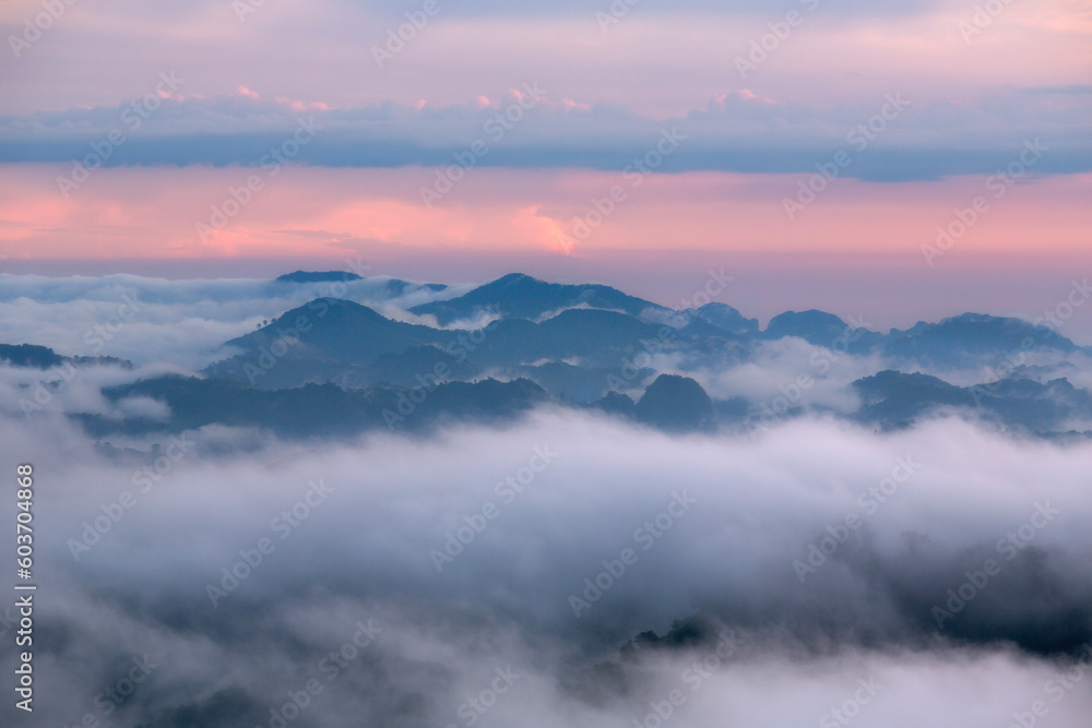 Aiyerweng sea of mist with the mountains during sunrise time. The ...