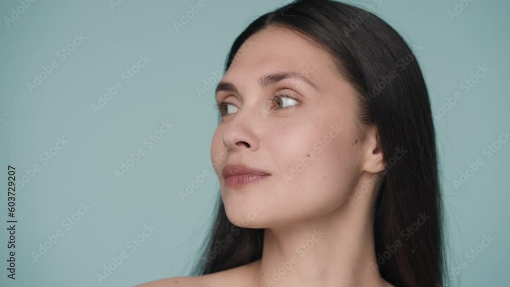 The woman demonstrates the perfect clean and fresh skin of the face ...