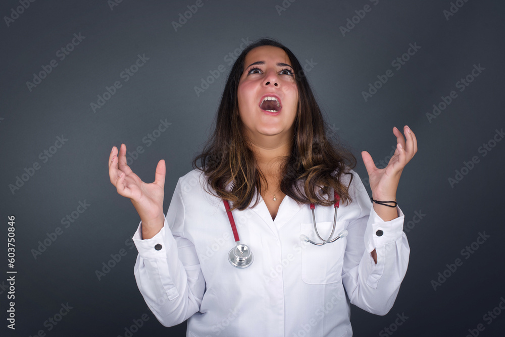 Screaming, hate, rage. Crying emotional angry woman screaming on blue ...