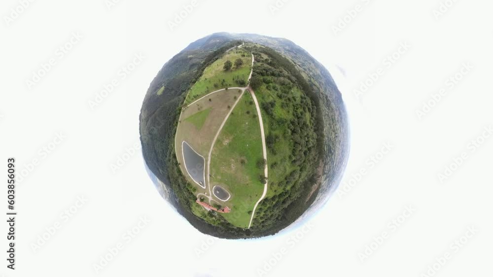 Aerial 360º drone view of a mountain with a picnic area between some ...
