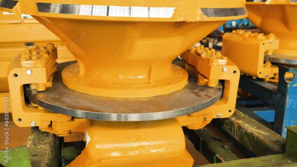 A hub with a brake disc and calipers for a dump truck on an assembly ...