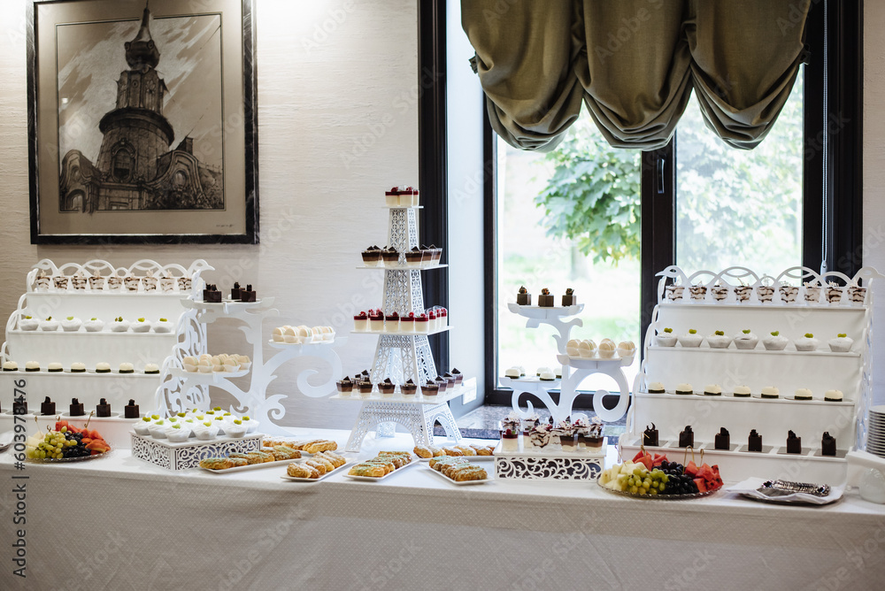 Sweet table. A plate of cakes and muffins. Table with sweets, buffet ...