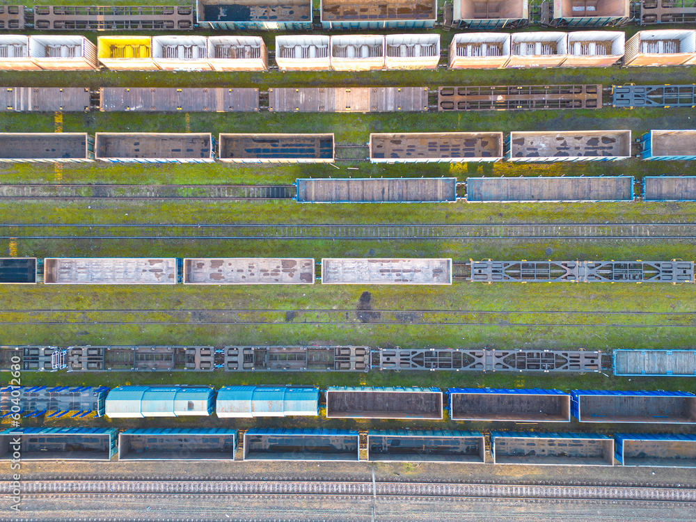 Cargo trains close-up. Aerial view of colorful freight trains on the ...