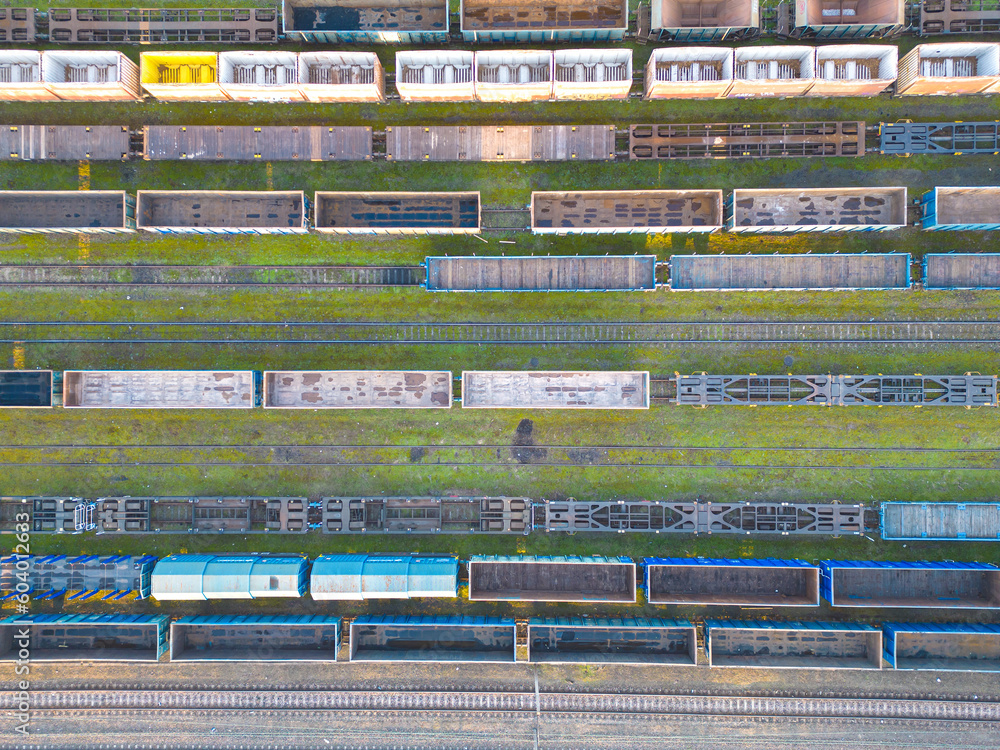 Cargo trains close-up. Aerial view of colorful freight trains on the ...