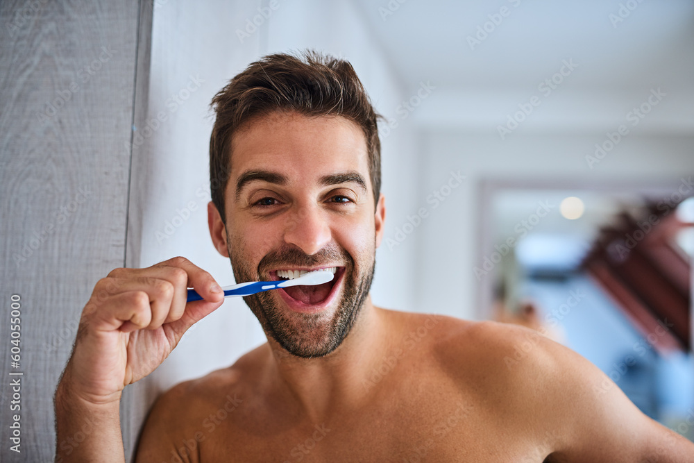 Portrait, toothbrush and face of happy man brushing teeth in home for ...