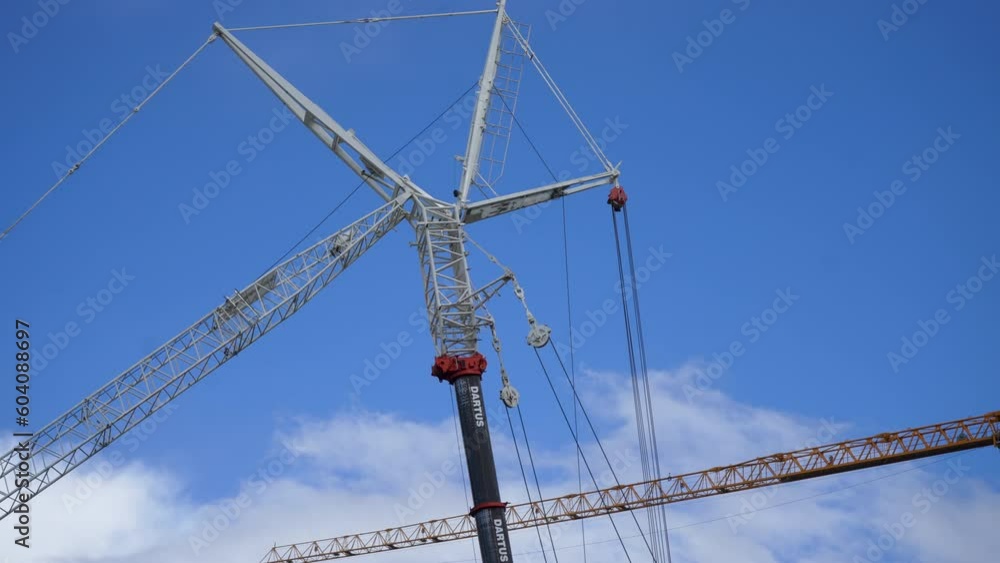 Paris, France - 3 May 2023. Hand held tracking shot of giant crane ...