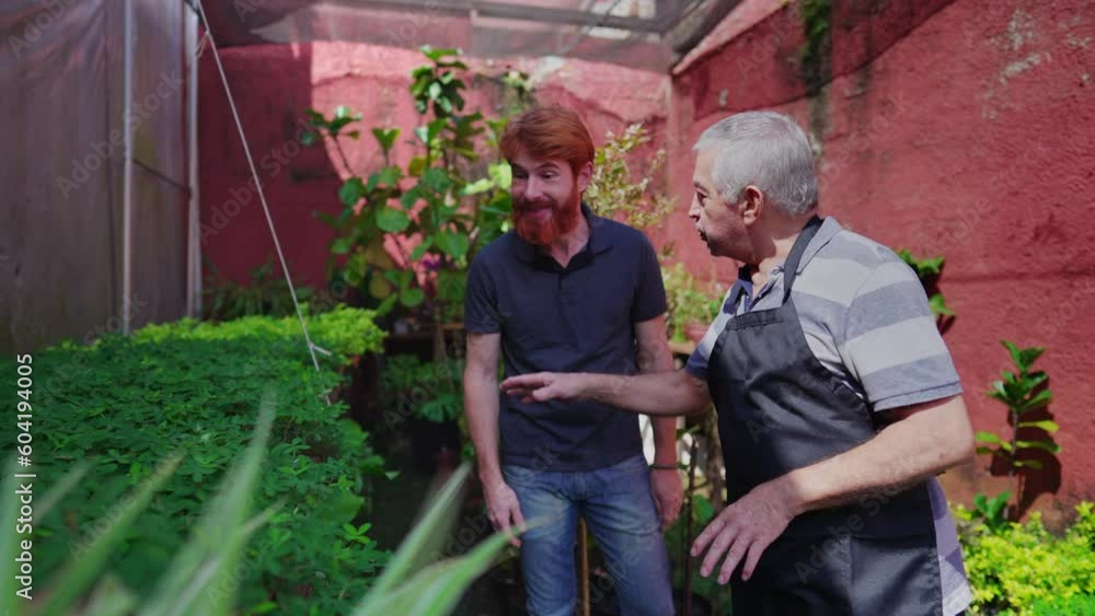 Experienced Gardener Assisting Customer at Plant Store. Horticulturist ...