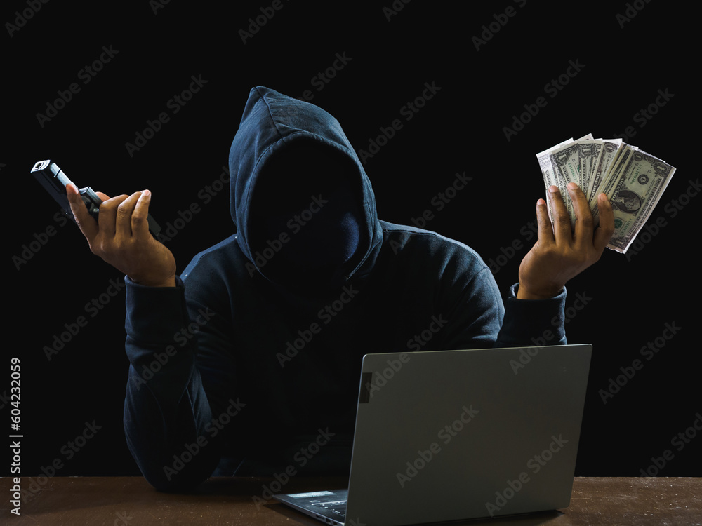 Foto de Hacker spy man wearing a black shirt, sitting on a chair and a ...