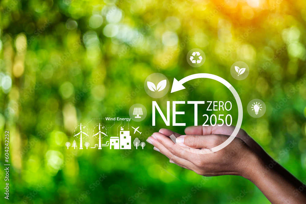 Net zero concept. Hand holding bulb with net zero icon. It is ...
