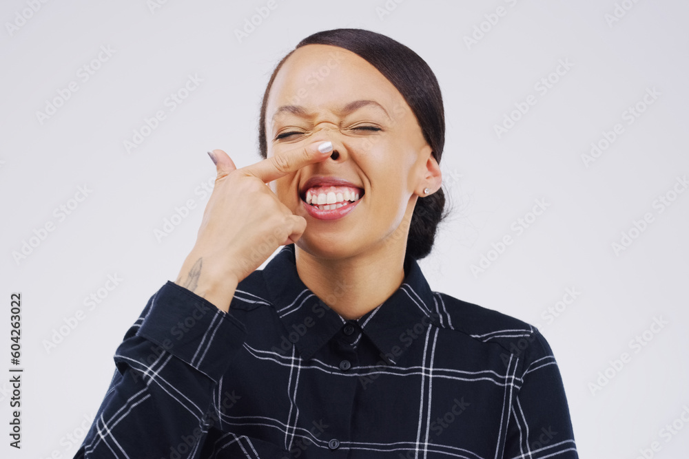 Portrait, funny face and finger on nose with a woman laughing in studio ...