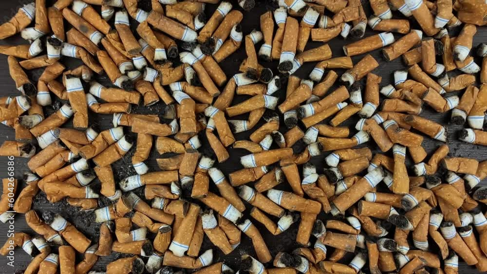 Many smoked cigarettes. Environmental pollution. Smoking harms health ...