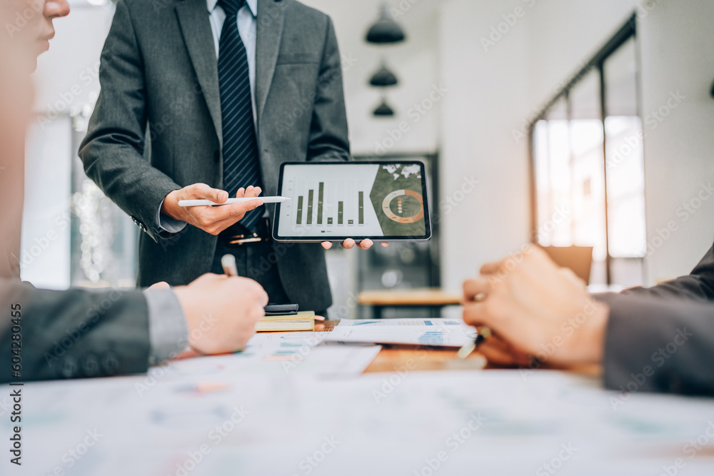 portrait of young asian business team presents business profits to ...