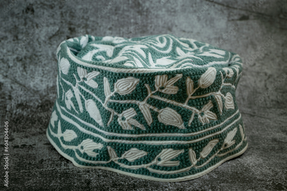 A traditional Omani cap in beautiful colors called kumma , which is ...