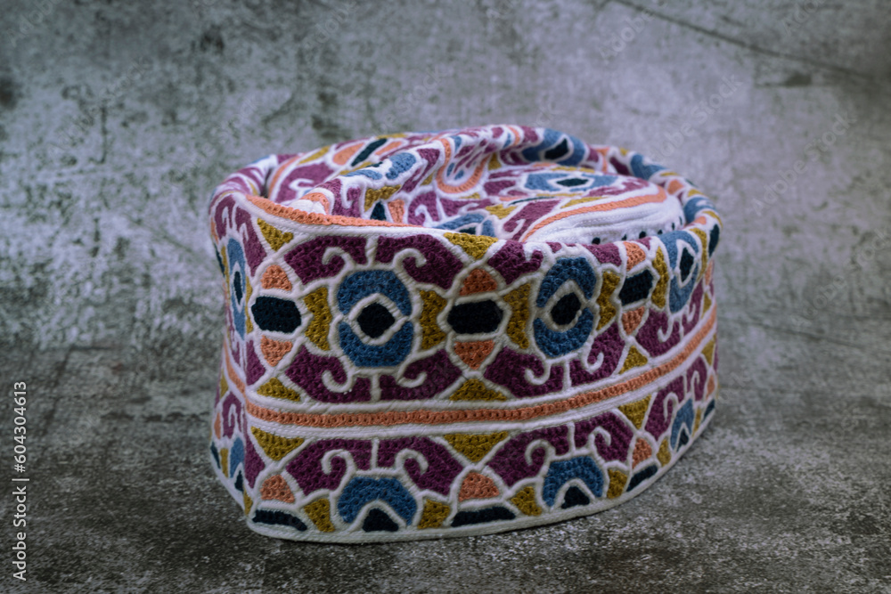 A traditional Omani cap in beautiful colors called kumma , which is ...