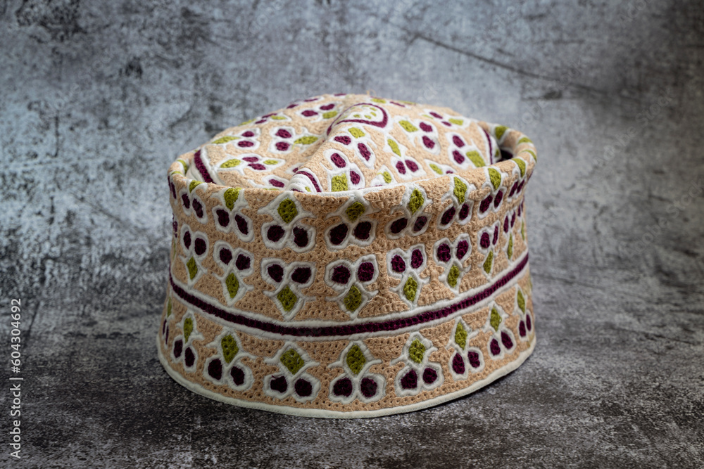 A traditional Omani cap in beautiful colors called kumma , which is ...
