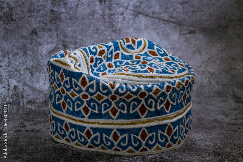 A traditional Omani cap in beautiful colors called kumma , which is ...
