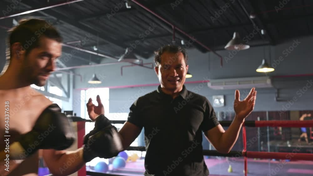 The boxing referee is explaining the rules before the two boxers fight ...