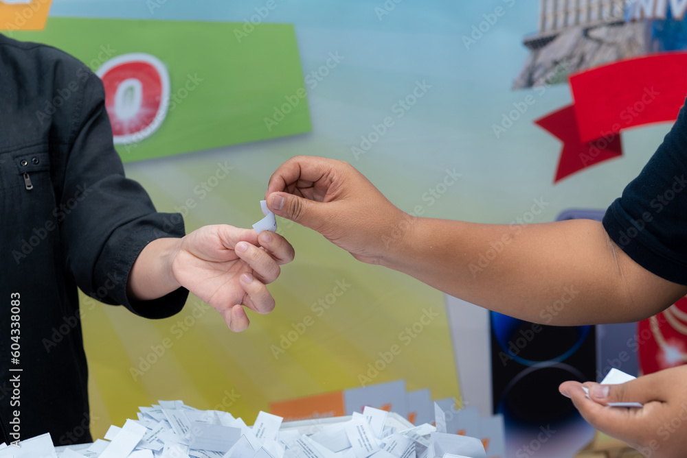 This photo shows a lucky draw being held at a local community center ...