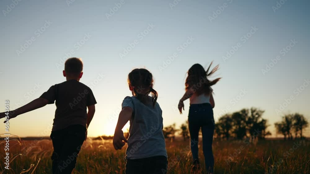 Children running in park at sunset. happy family kindergarten kids ...