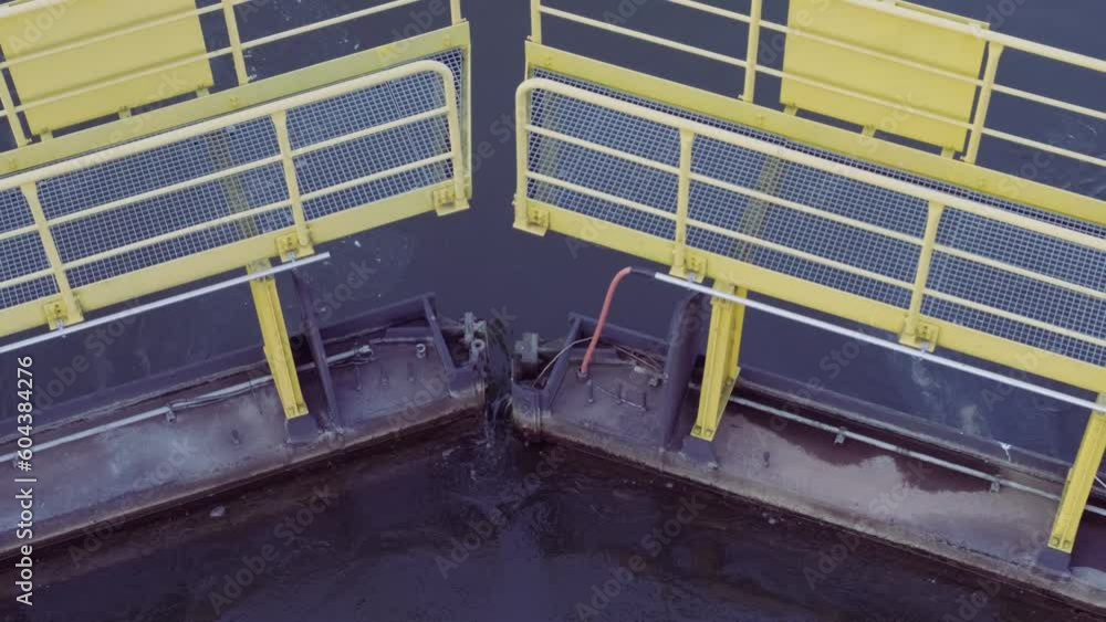 yellow metal gate slowly opens passage through narrow lock on navigable ...