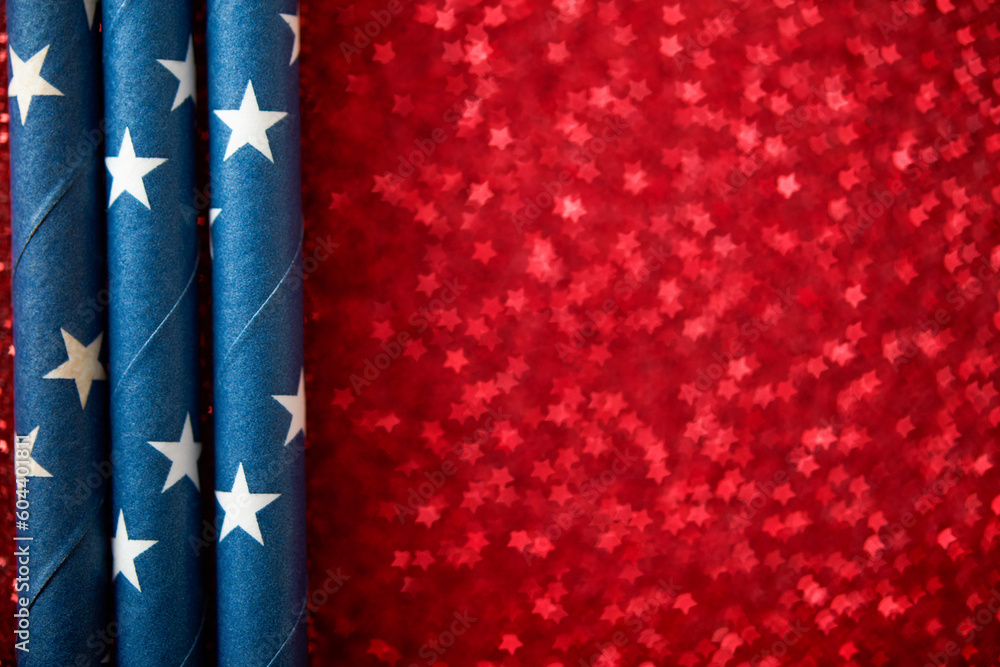 4th of July. Red abstract background from bokeh stars of glitters and ...