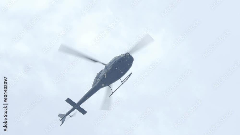 Helicopter flying in the sky low angle shot footage. Helicopter in ...