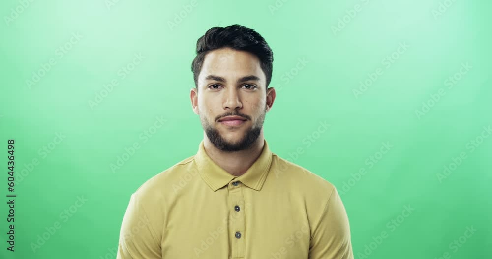 Serious, looking and face of a man on a green screen isolated on studio ...