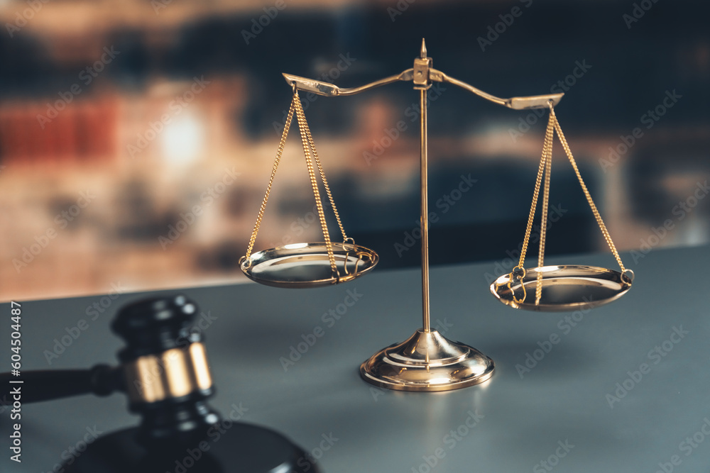 Shiny golden balanced scale and wooden gavel in law firm or lawyer office background as concept ...