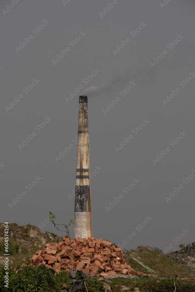 Tall brick kiln in a rural area close up shot. Brick kiln with brick ...