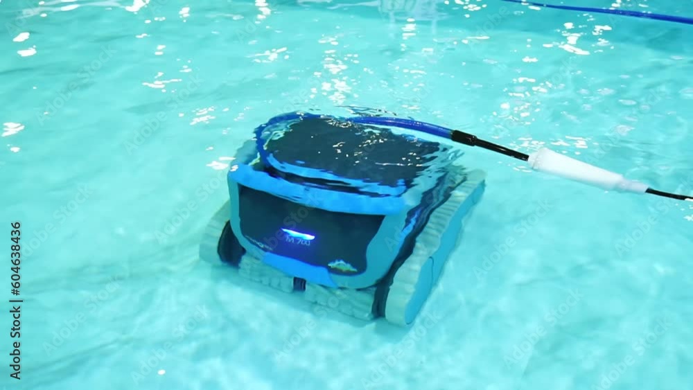 robot pool cleaner. Pool maintenance with automatic robot. Summer pool ...