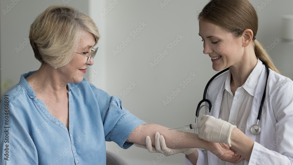 Elderly 60s woman receive professional medical care during visit in ...