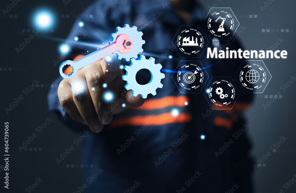 Engineer pointing at a 3D wrench to perform periodic maintenance on ...