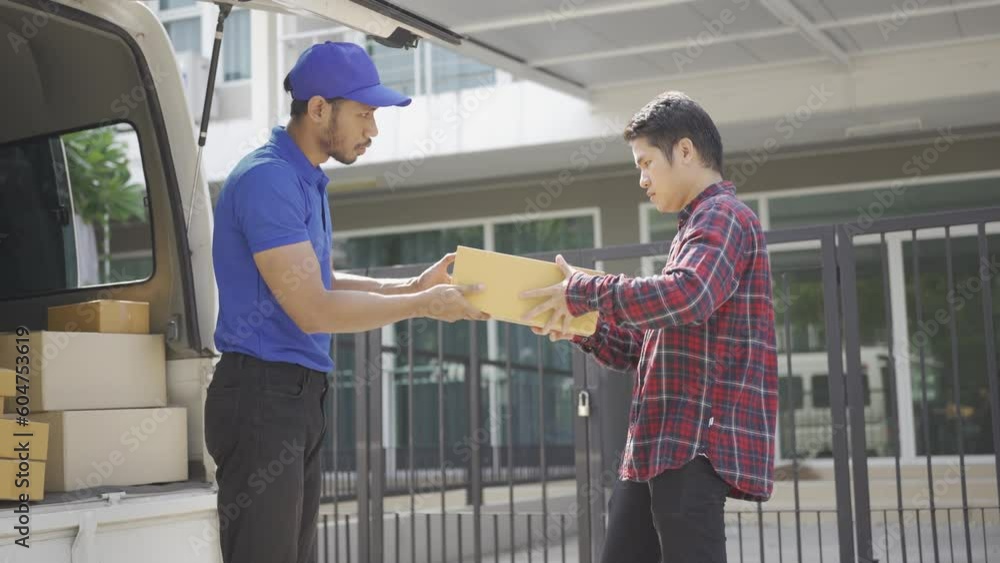 Postman delivering parcel home with smile and happy face, Asian man ...