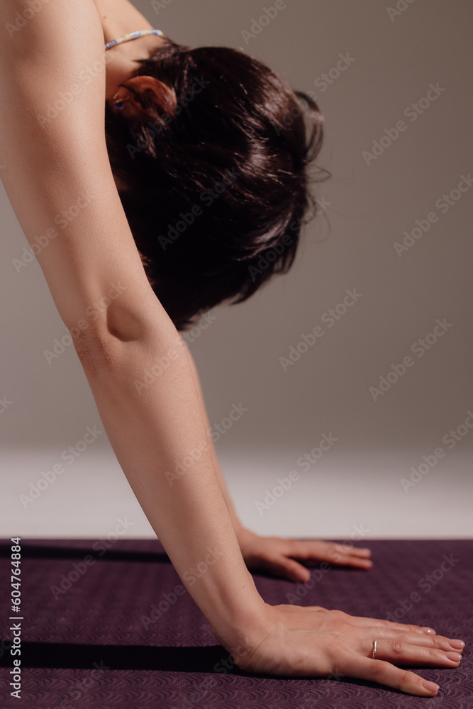 Attractive woman bending body close up. Athletic woman stretches her ...