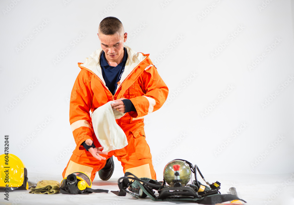 Firefighter hoods reveal their determined expressions and the sweat ...