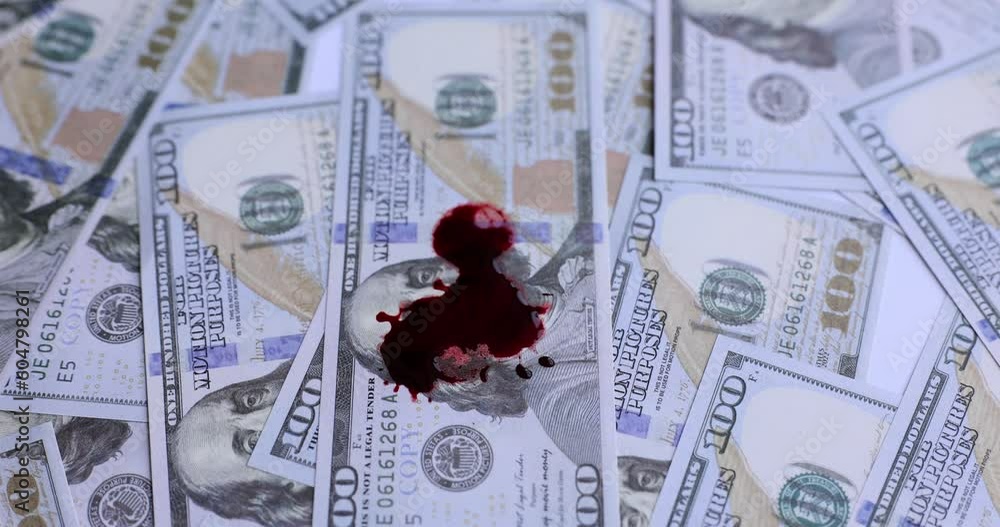 100 dollar bill with blood stains closeup. Blood money and crime Stock ...