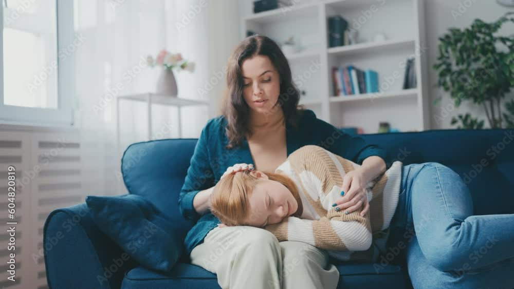 Middle-aged mother comforting her crying teen daughter, broken heart ...