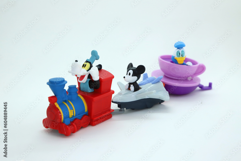 Goofy, Mickey Mouse and Donald Duck in toy train of the attractions of ...